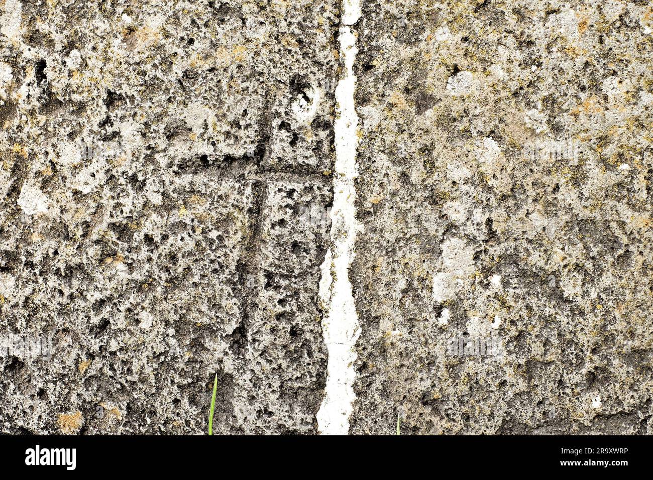 Cross symbol carved in old stone element. Medieval Christian symbolism ...