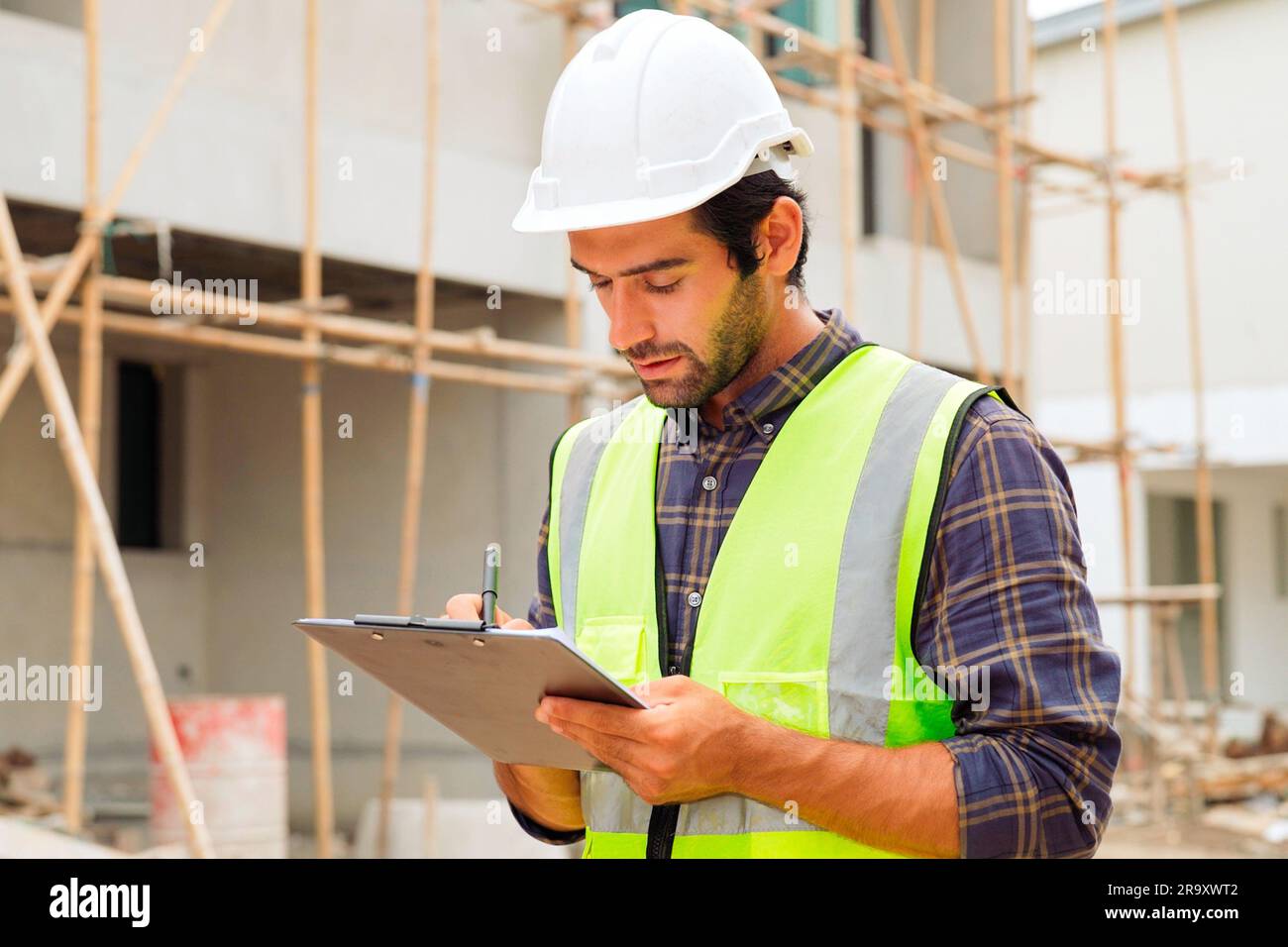 Portrait of cvil engineer with safety uniform working at construction ...