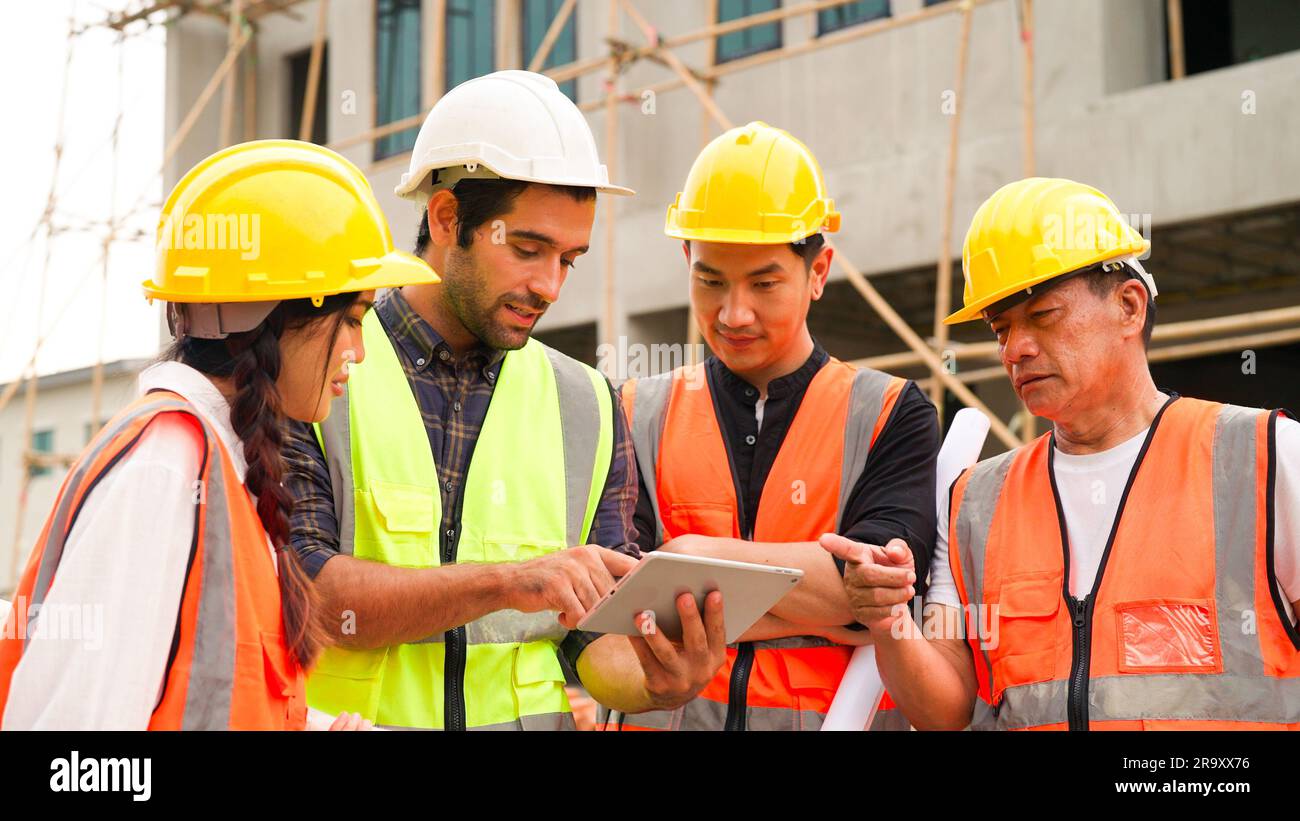 Civil engineers team with safety hard hat working together at ...