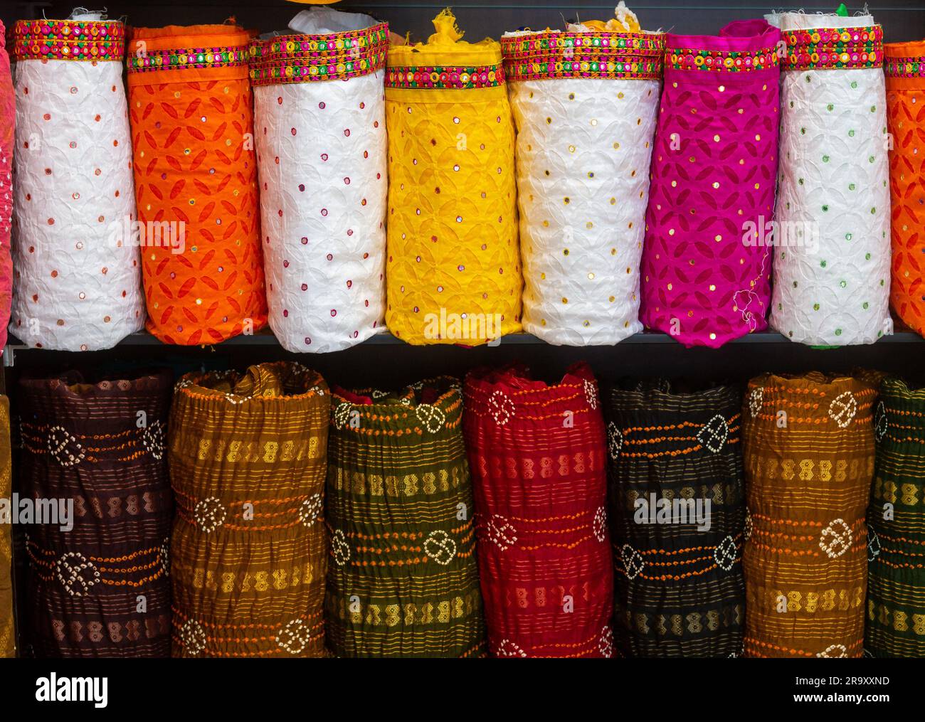 Colorful indian female cloths stack in wholesale shop in India Stock ...