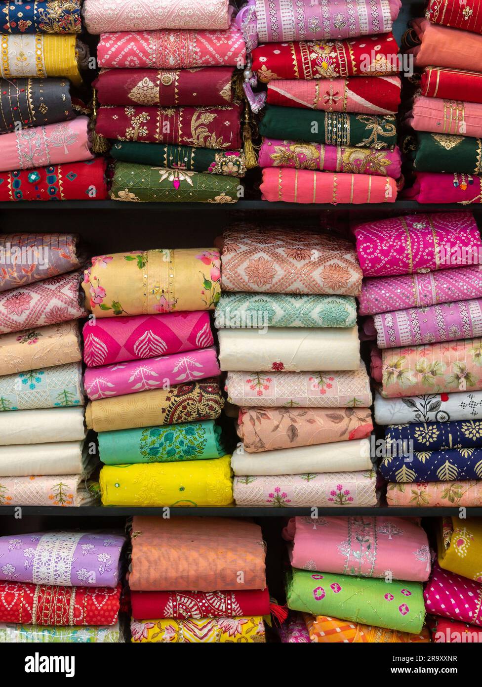 Colorful indian female cloths stack in wholesale shop in India Stock ...