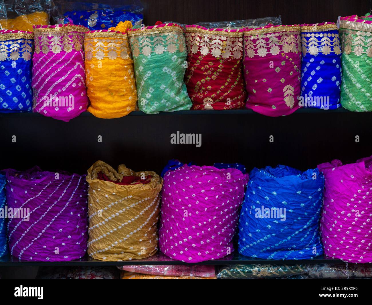 Colorful indian female cloths stack in wholesale shop in India Stock ...