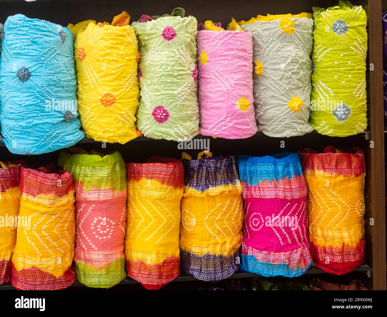 Colorful indian female cloths stack in wholesale shop in India Stock ...