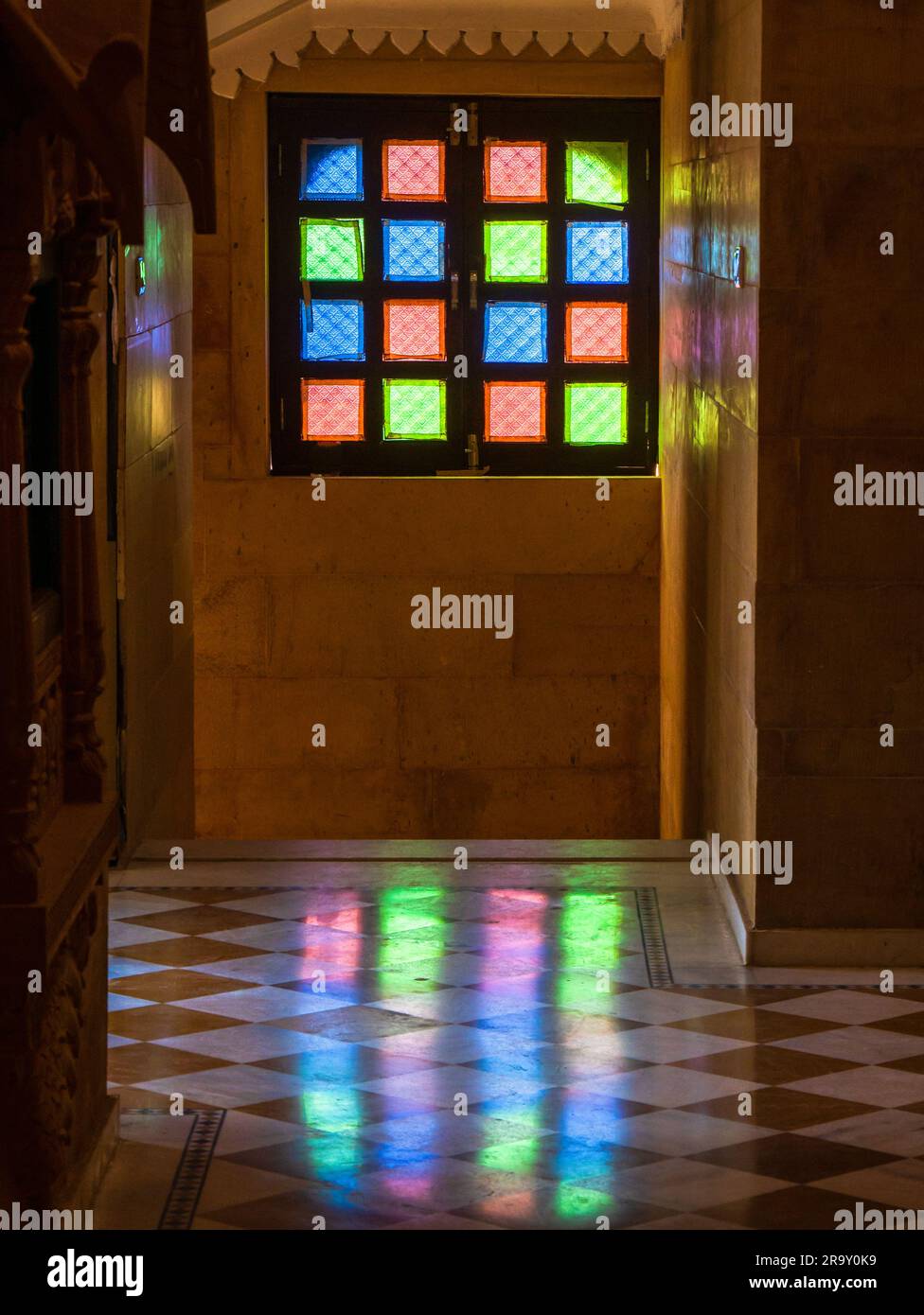 Light from multicoloured stained glass window panes through haze Stock ...