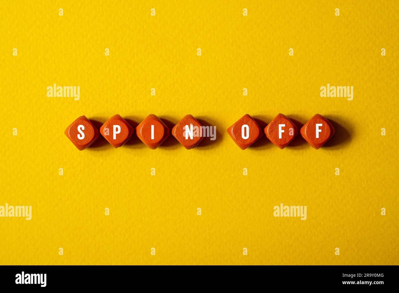 Spin off - word concept on building blocks, text Stock Photo - Alamy