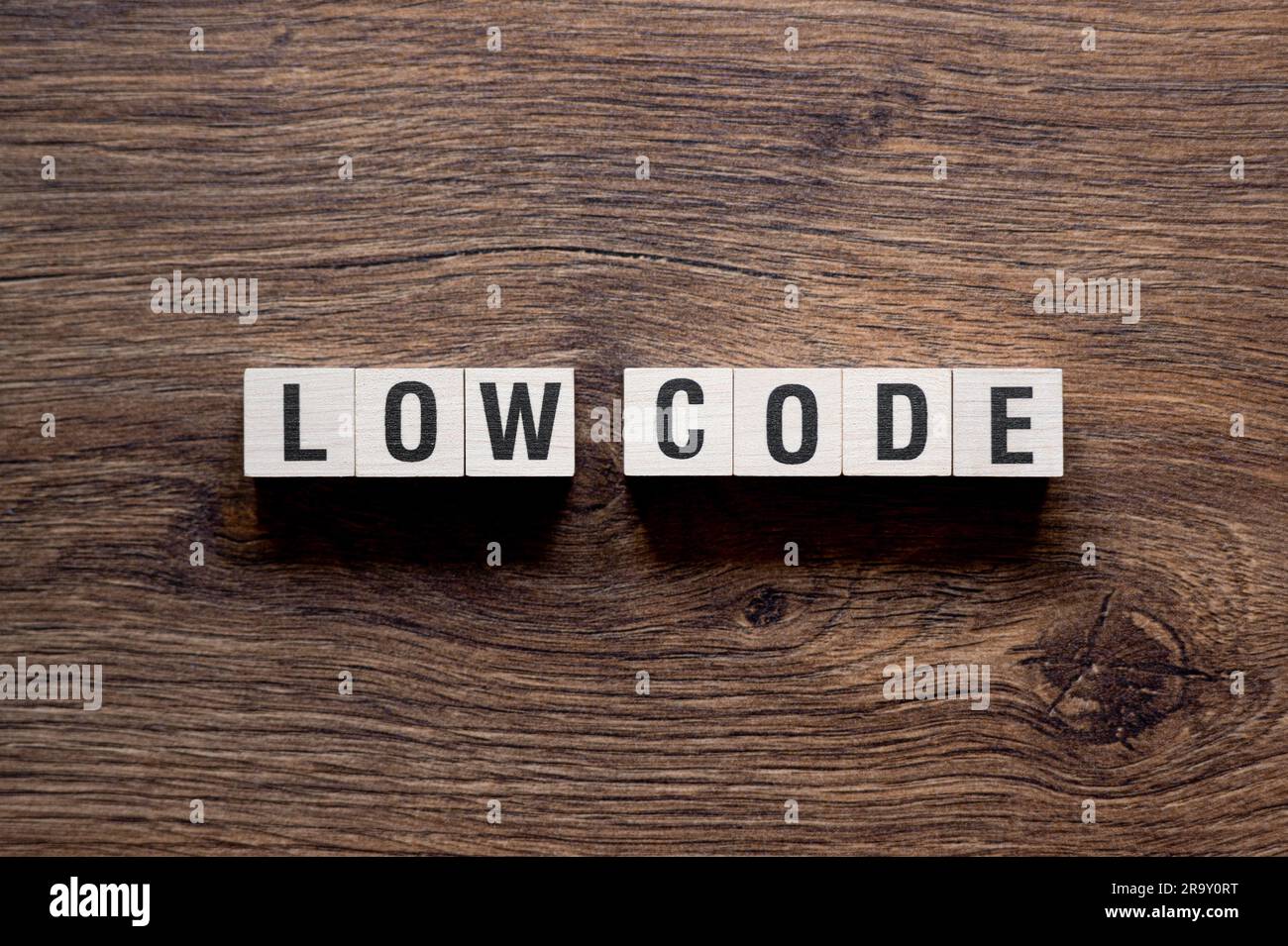 Low code - word concept on building blocks, text Stock Photo - Alamy