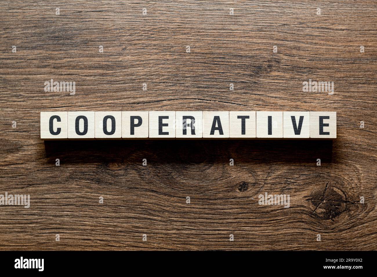 Cooperative - word concept on building blocks, text Stock Photo - Alamy