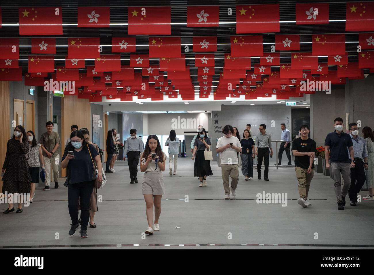 Hong Kong, China. 27th June, 2023. People walk along the Central ...
