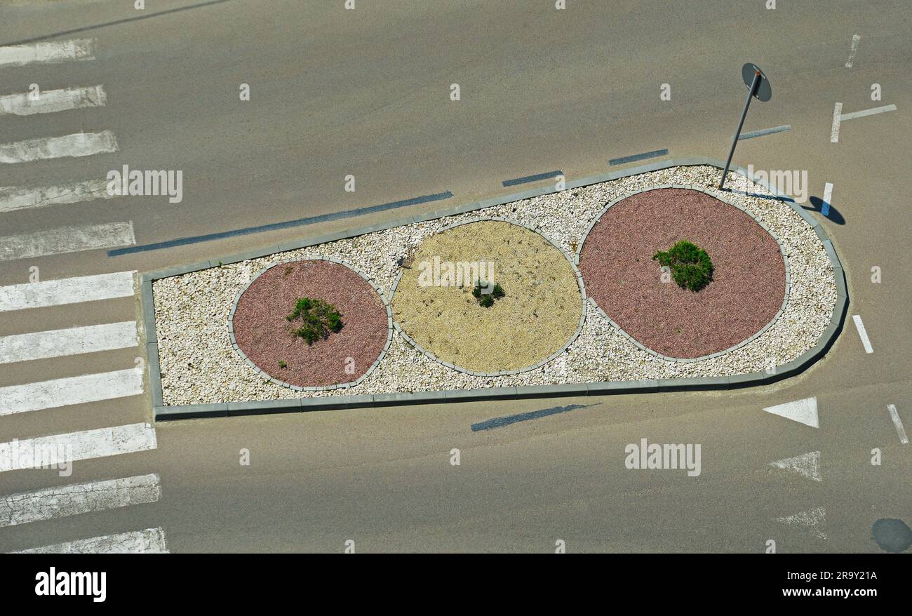 Pedestrian crossing and safety island made of multi-colored gravel ...