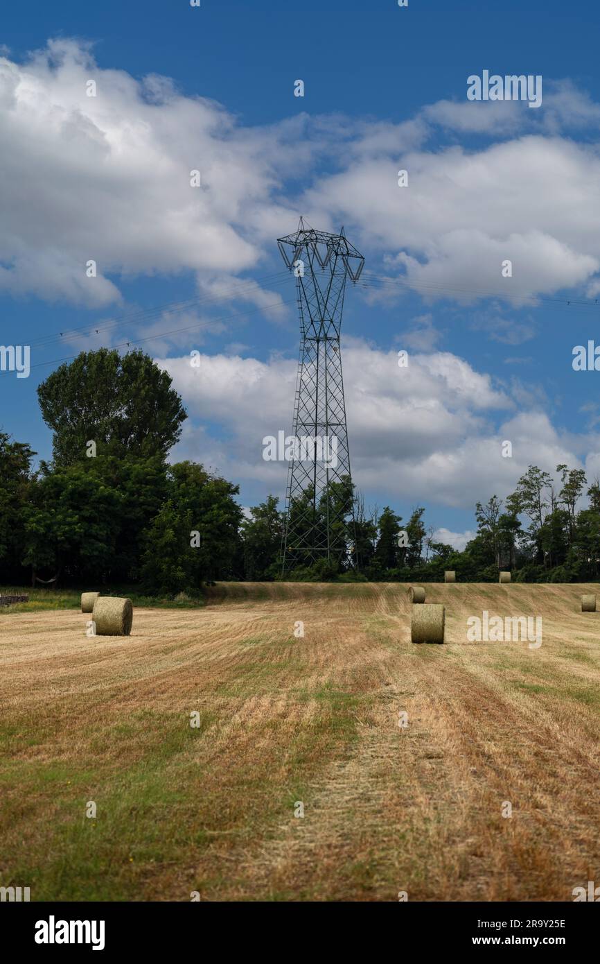 Rural landscape farm fields and energy transition power line pylon ...