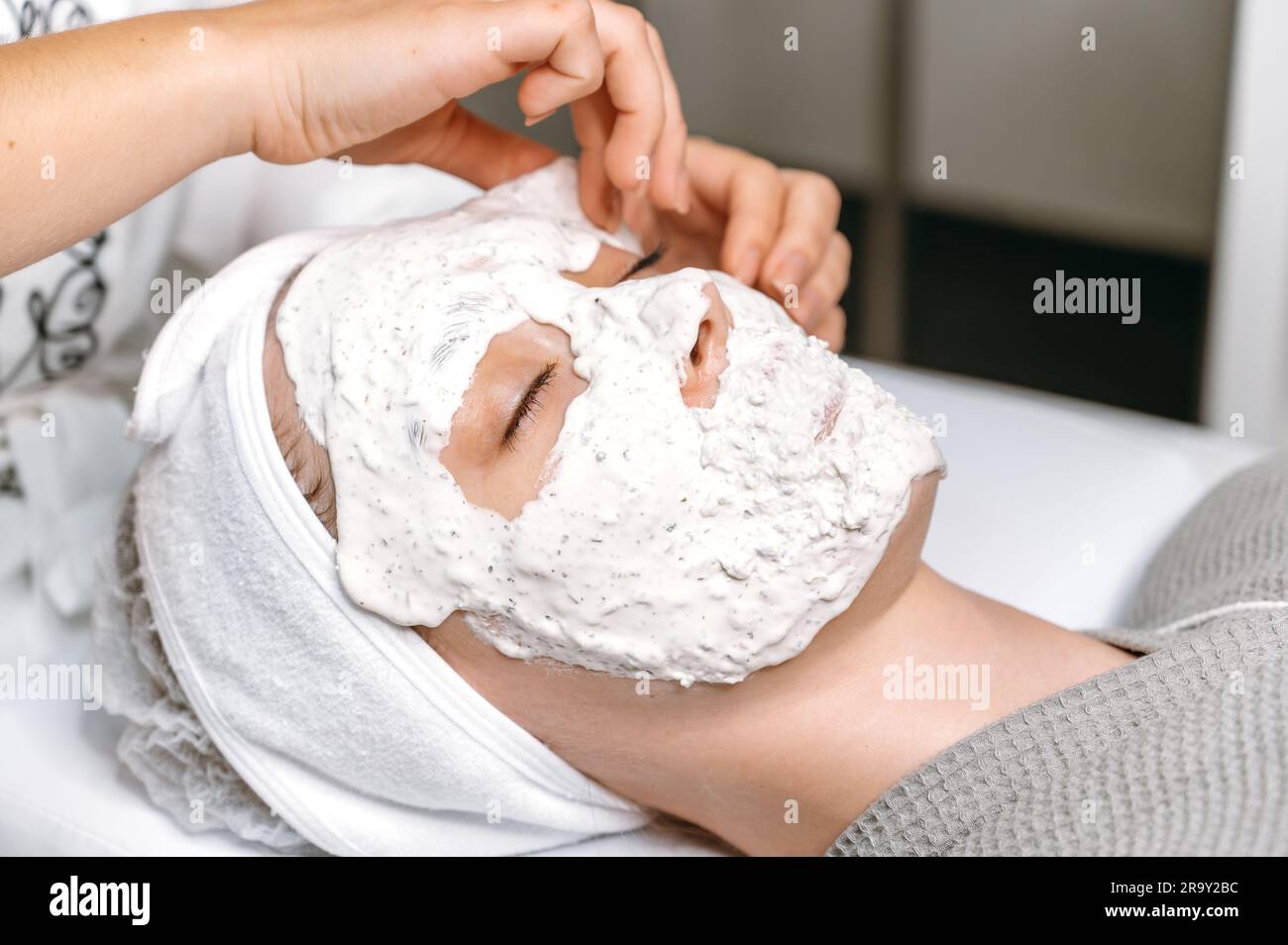 Close-up of removing the mask from the woman's face. Moisturizing ...
