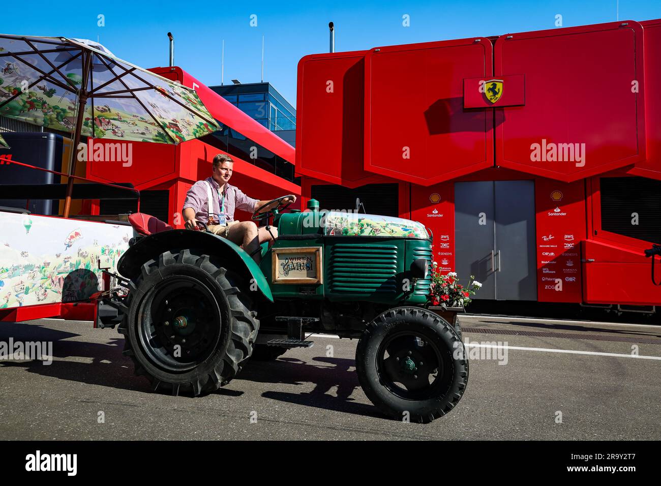 A tractor in front of the Scuderia Ferrari paddock during the 2023 ...