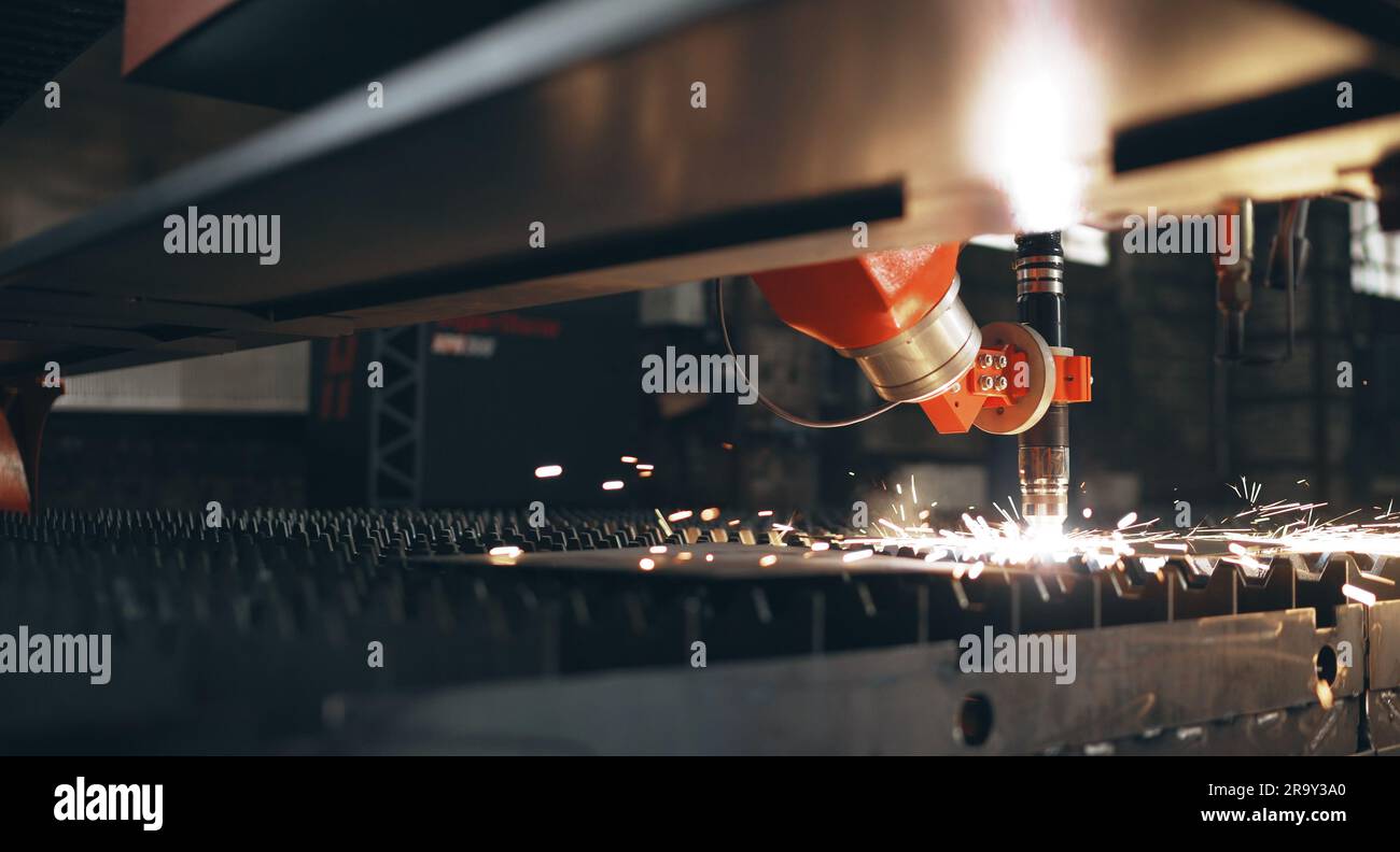 cutting metal with plasma laser close up. Thick metal laser cutting. A ...