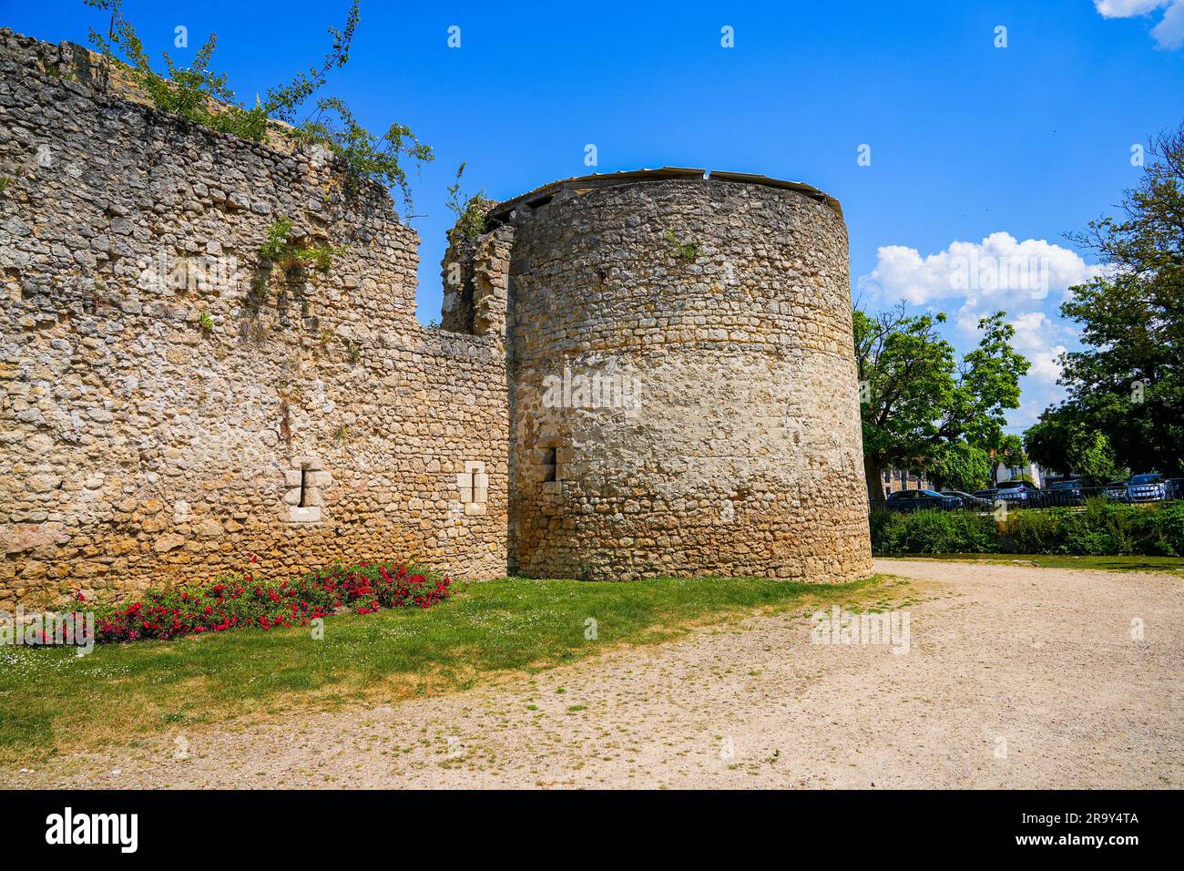 Round corner tower of the medieval castle of Brie Comte Robert in the ...