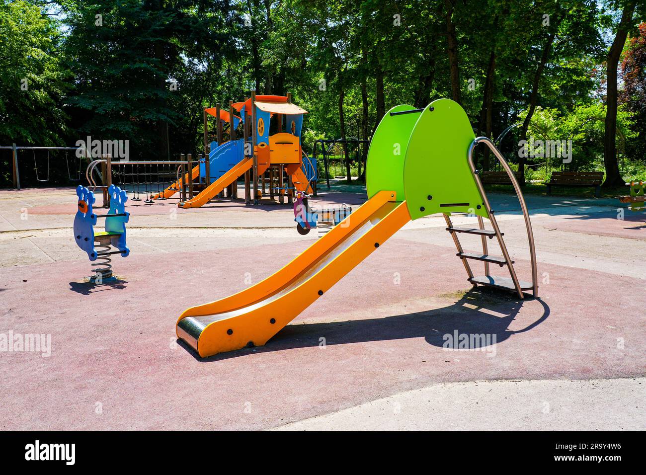 Playground equipment on a red rubber floor in the Parc des Bienfaites ...
