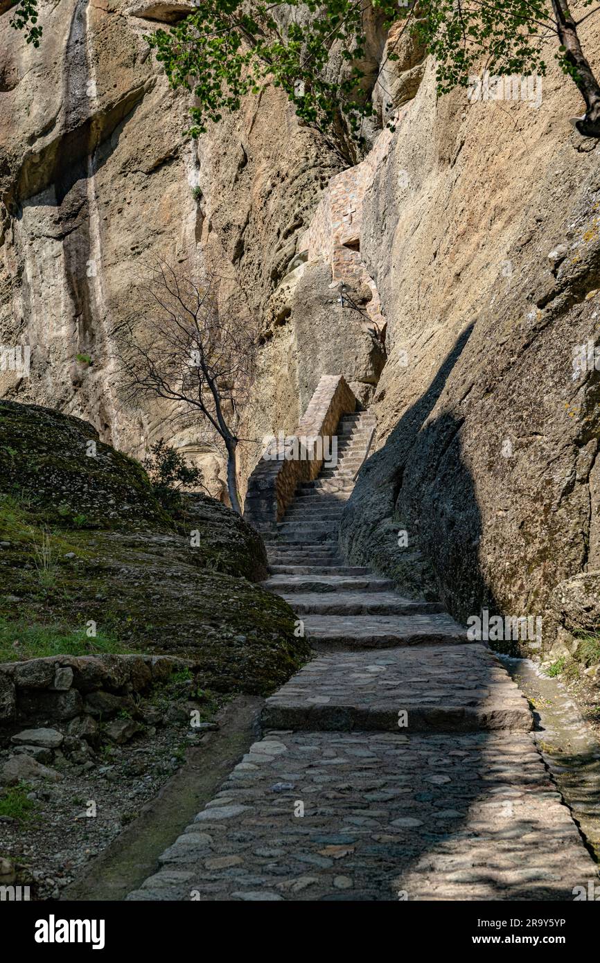 A scenic pathway with stone steps leading to monasteries in Kalabaka ...