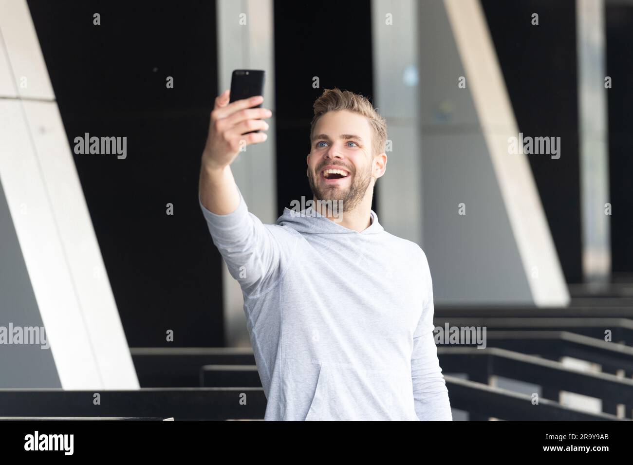 happy man make selfie smartphone of himself. man make selfie smartphone ...