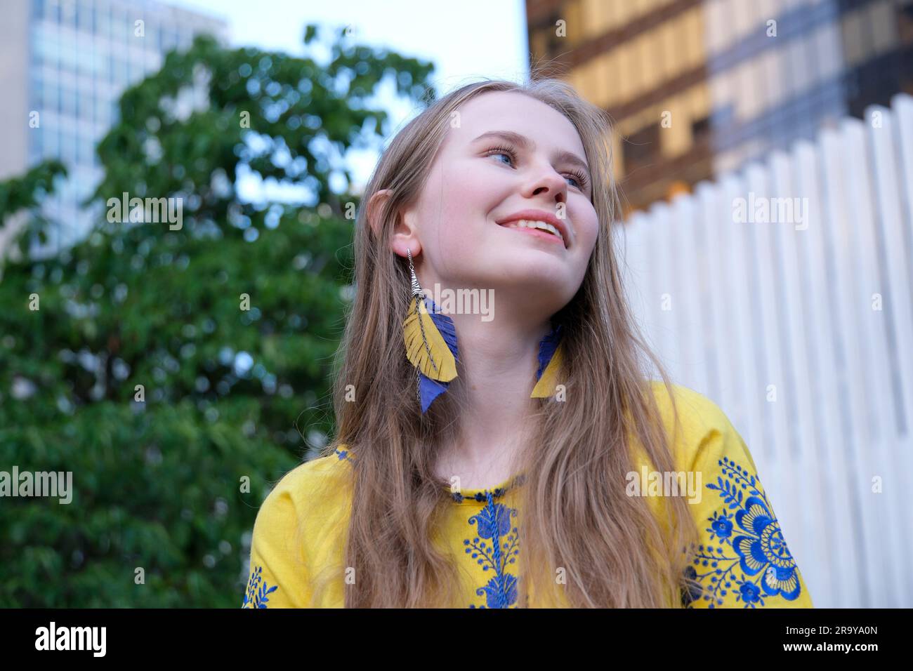 yellow shirt with blue flowers embroidery beautiful young girl. Woman ...