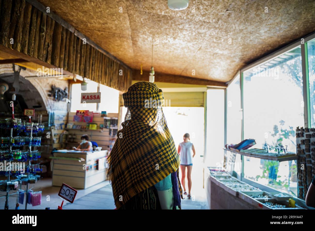 A rear of a mannequin wearing turkish scarf covering whole head in ...