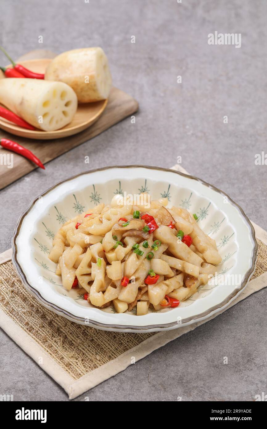 Cold tender lotus root tip, Spicy sauteed lotus root Stock Photo - Alamy