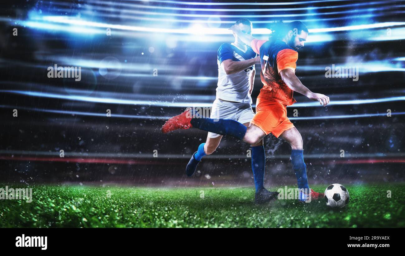 Football action scene with competing soccer players at the stadium ...