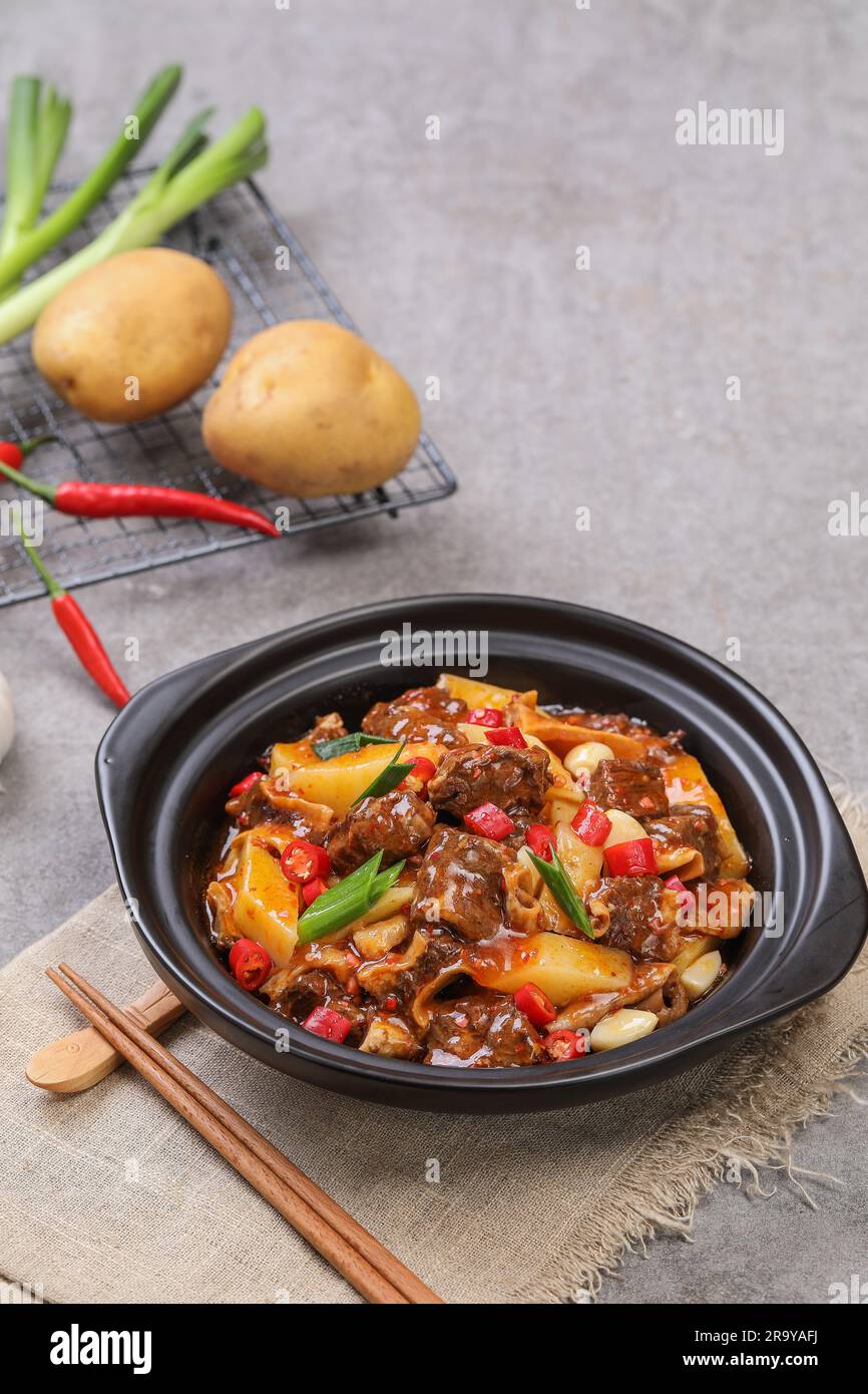 Braised Beef Brisket with Potato in Clay pot Stock Photo - Alamy