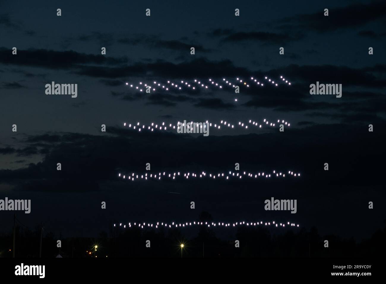 Riga, Latvia - 27.04.2023: Baltic Drone Show, rows of drones descend to ...