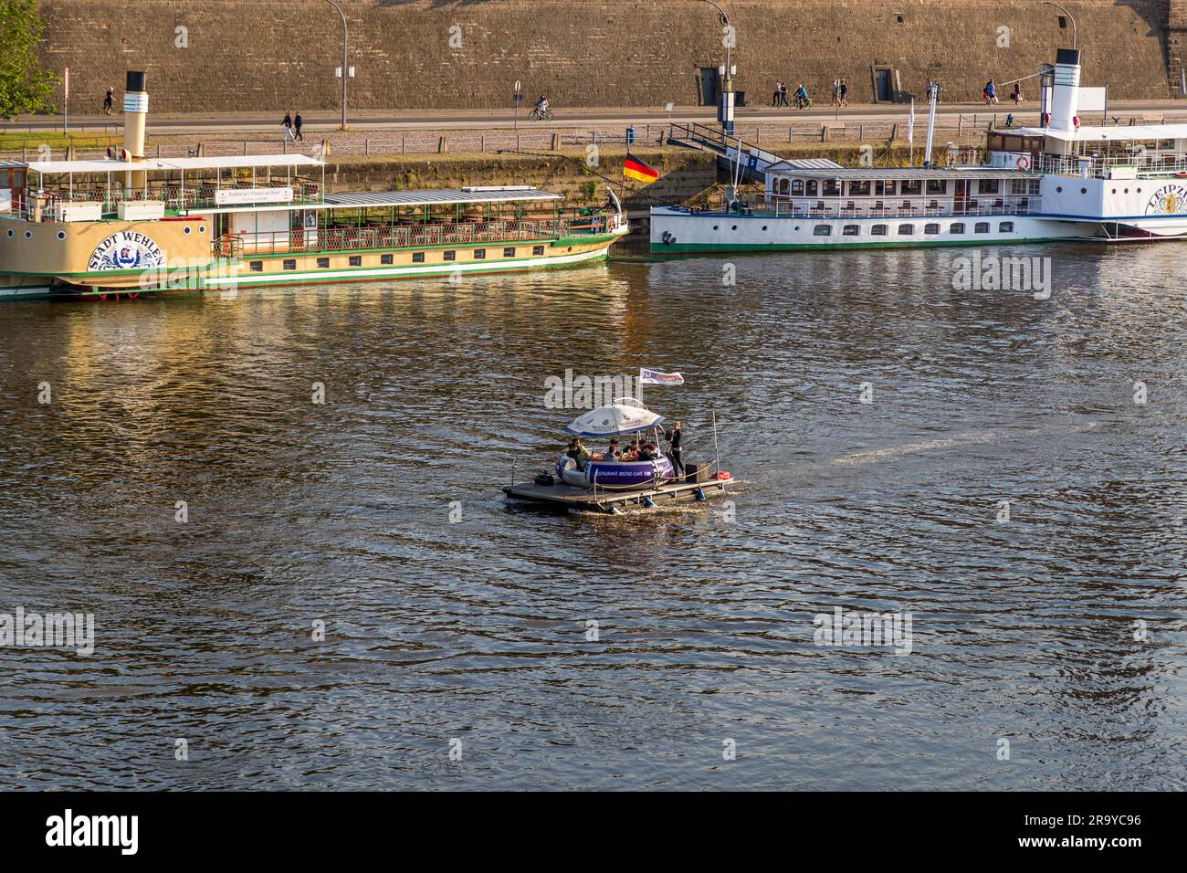 Tourist amusement on the Elbe near Dresden. Party raft in the ...