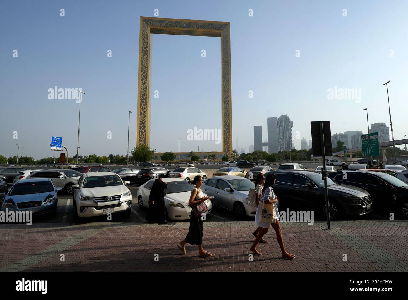 People pass by in front of the Dubai Frame in Dubai, United Arab ...