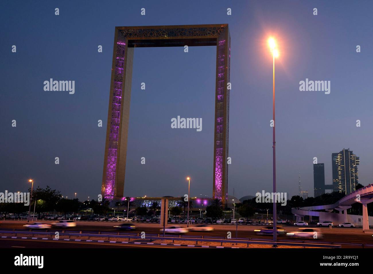Cars pass by in front of the Dubai Frame in Dubai, United Arab Emirates ...
