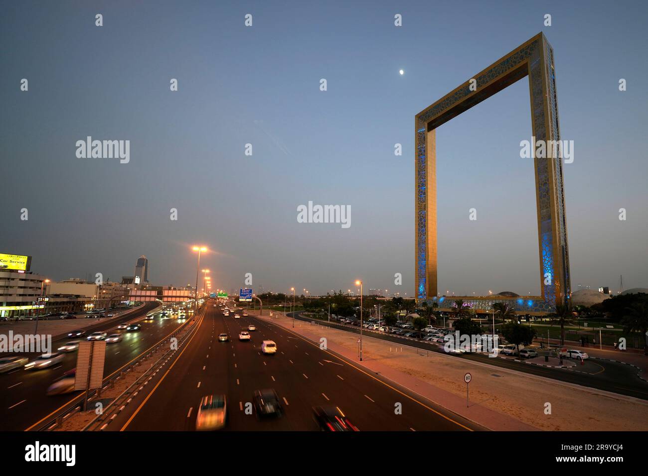 Cars pass by in front of the Dubai Frame in Dubai, United Arab Emirates ...
