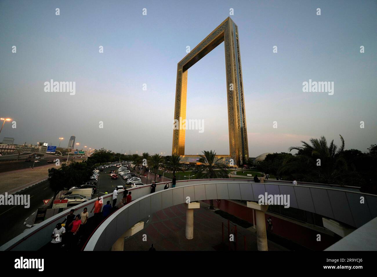 People pass by in front of the Dubai Frame in Dubai, United Arab ...
