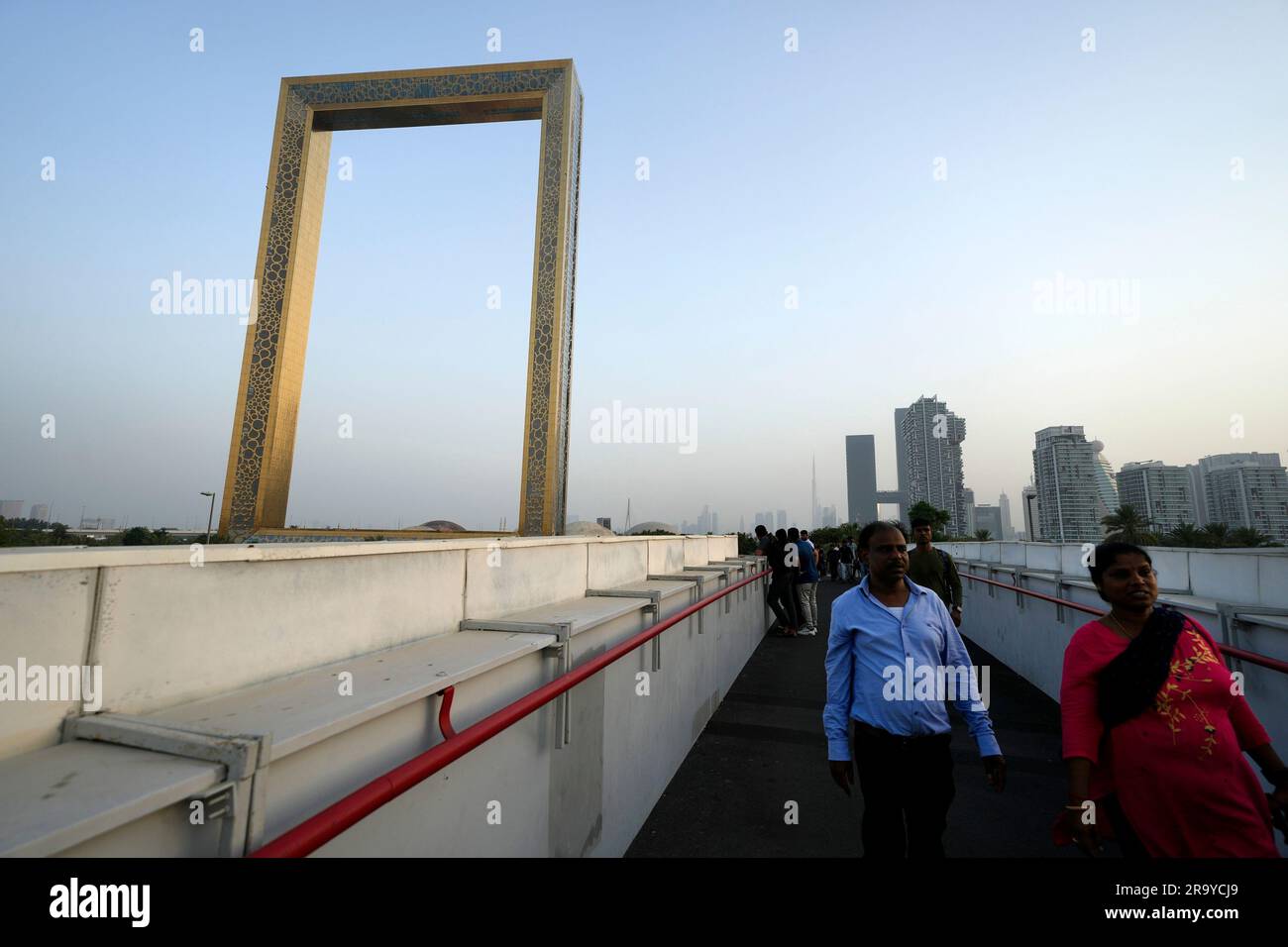 People pass by in front of the Dubai Frame in Dubai, United Arab ...