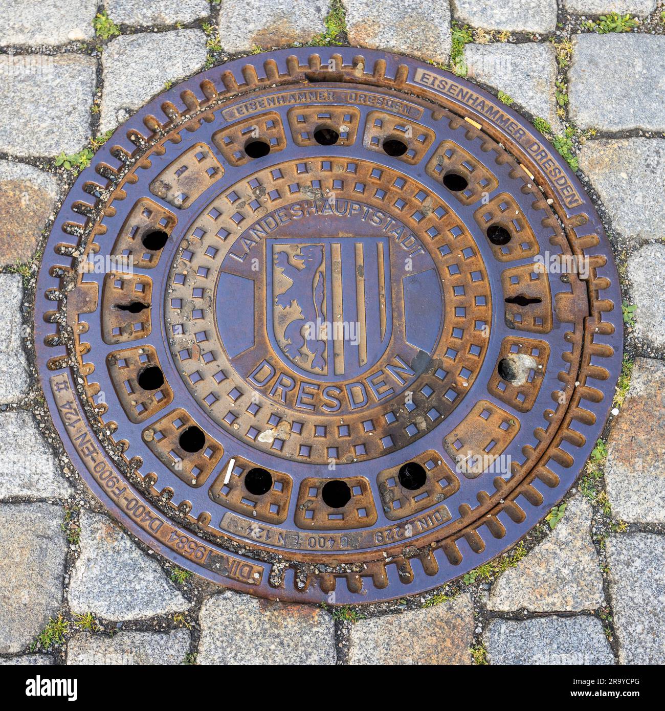 Manhole cover in road hi-res stock photography and images - Alamy