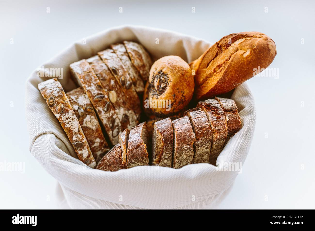 Sliced bread in linen bread box bread storage Stock Photo - Alamy