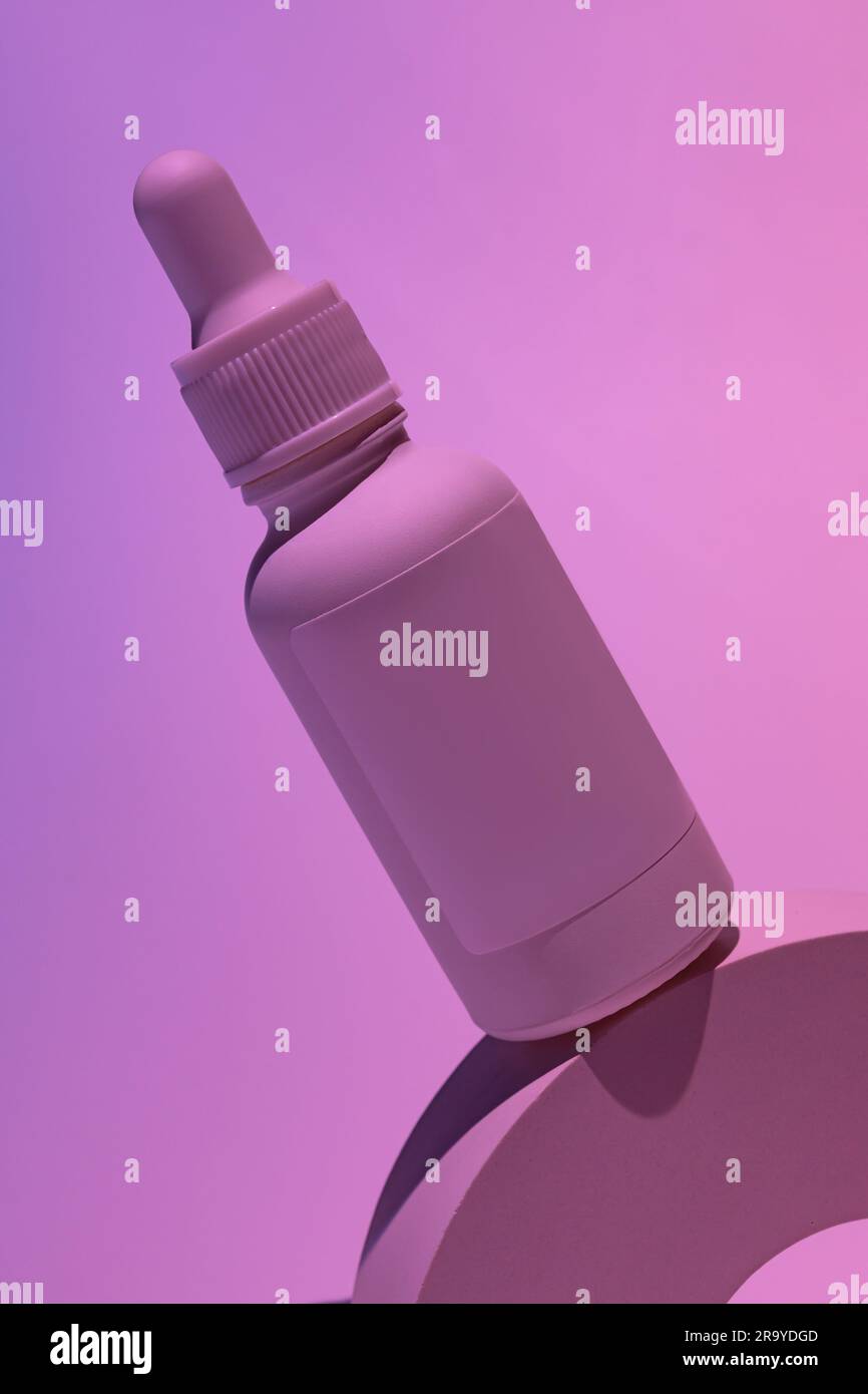 Beauty face oil in a glass dropper bottle on Arch. Trendy shoot of ...
