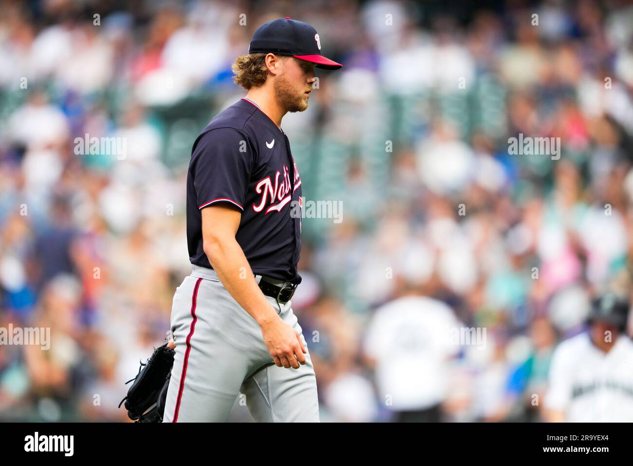 Washington Nationals starting pitcher Jake Irvin walks off the field ...