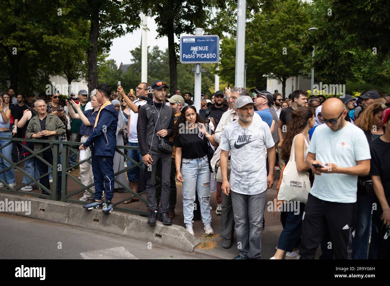 People during a commemoration march (marche blanche) for Nahel, in the ...