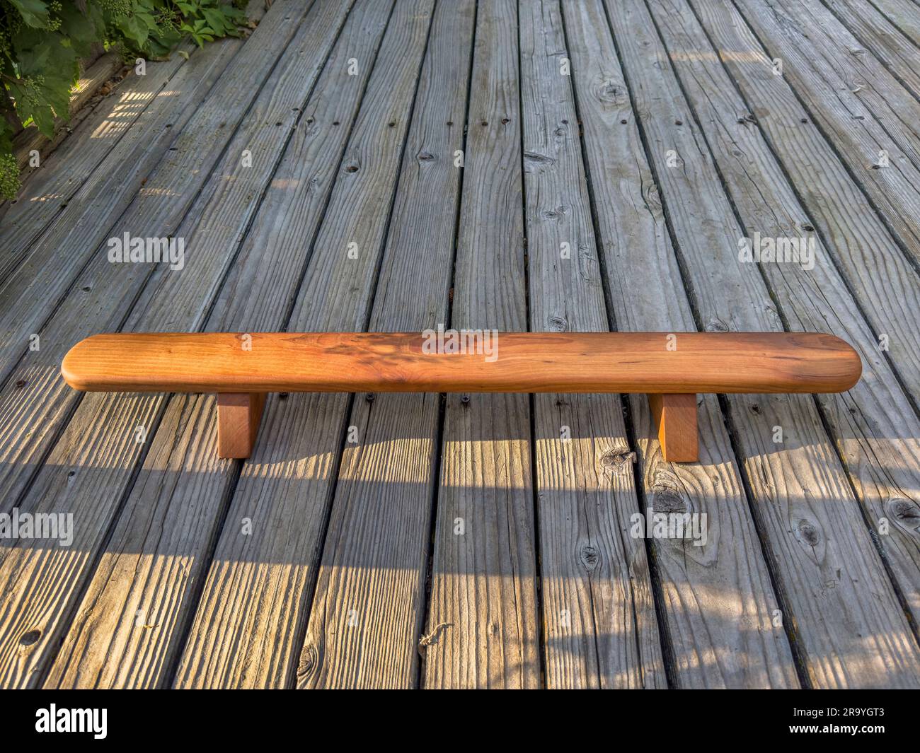Persian shena push up board on a backyard wooden deck Stock Photo - Alamy
