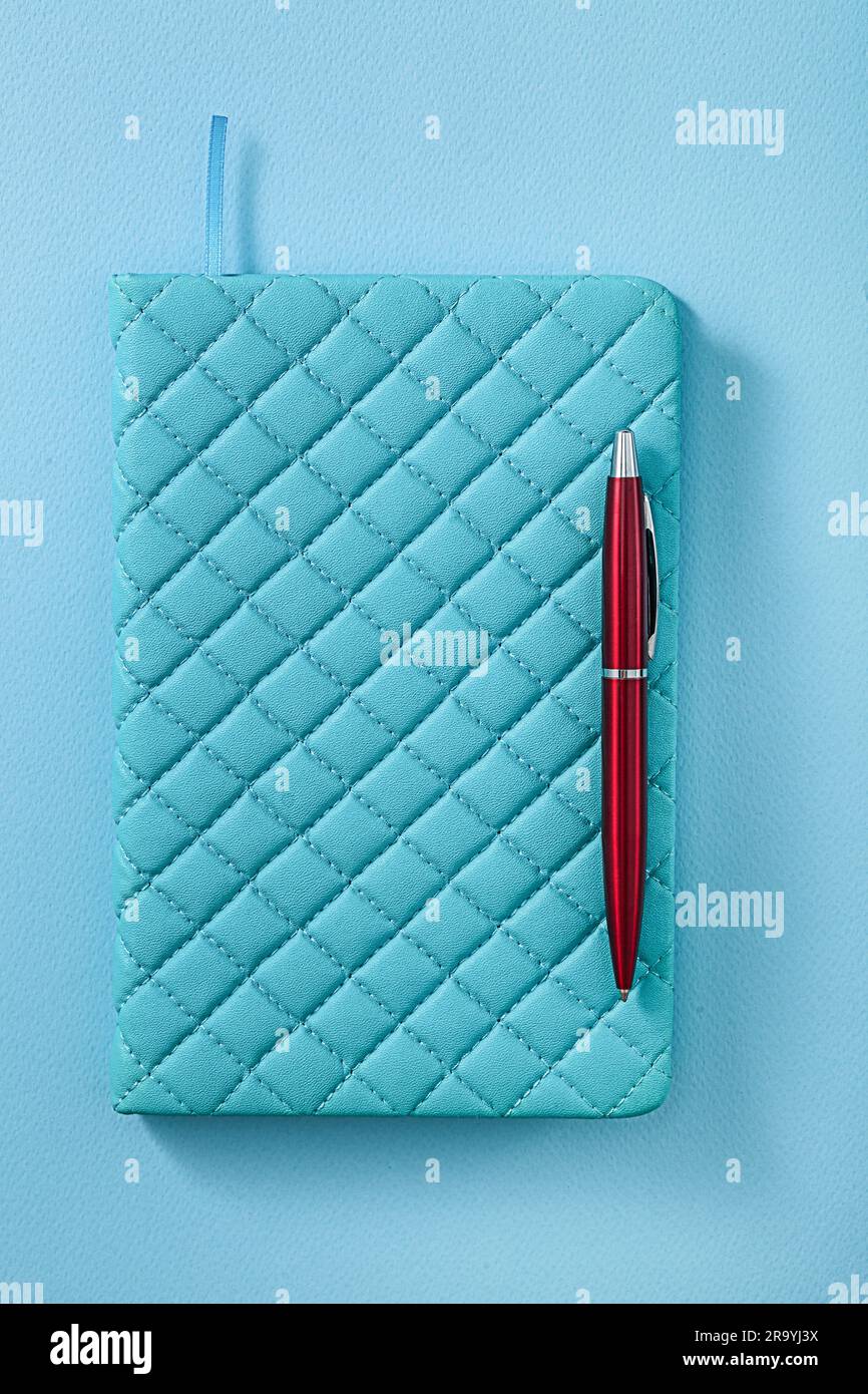 Blue Notepad And Red Ballpoint Pen Stock Photo - Alamy