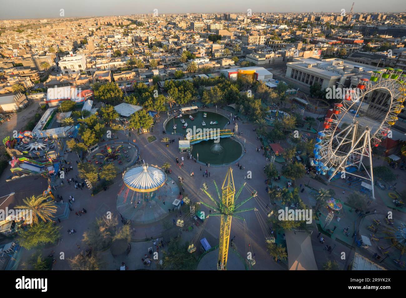 Iraqis enjoy rides at an amusement park during Eid al-Adha in Baghdad ...
