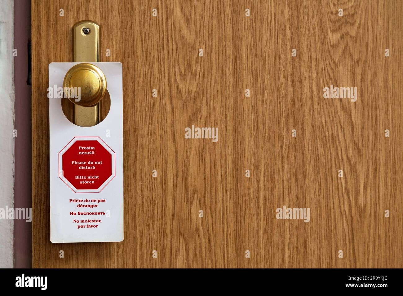 A "Do not disturb" sign in 6 languages hanging from the hotel room ...