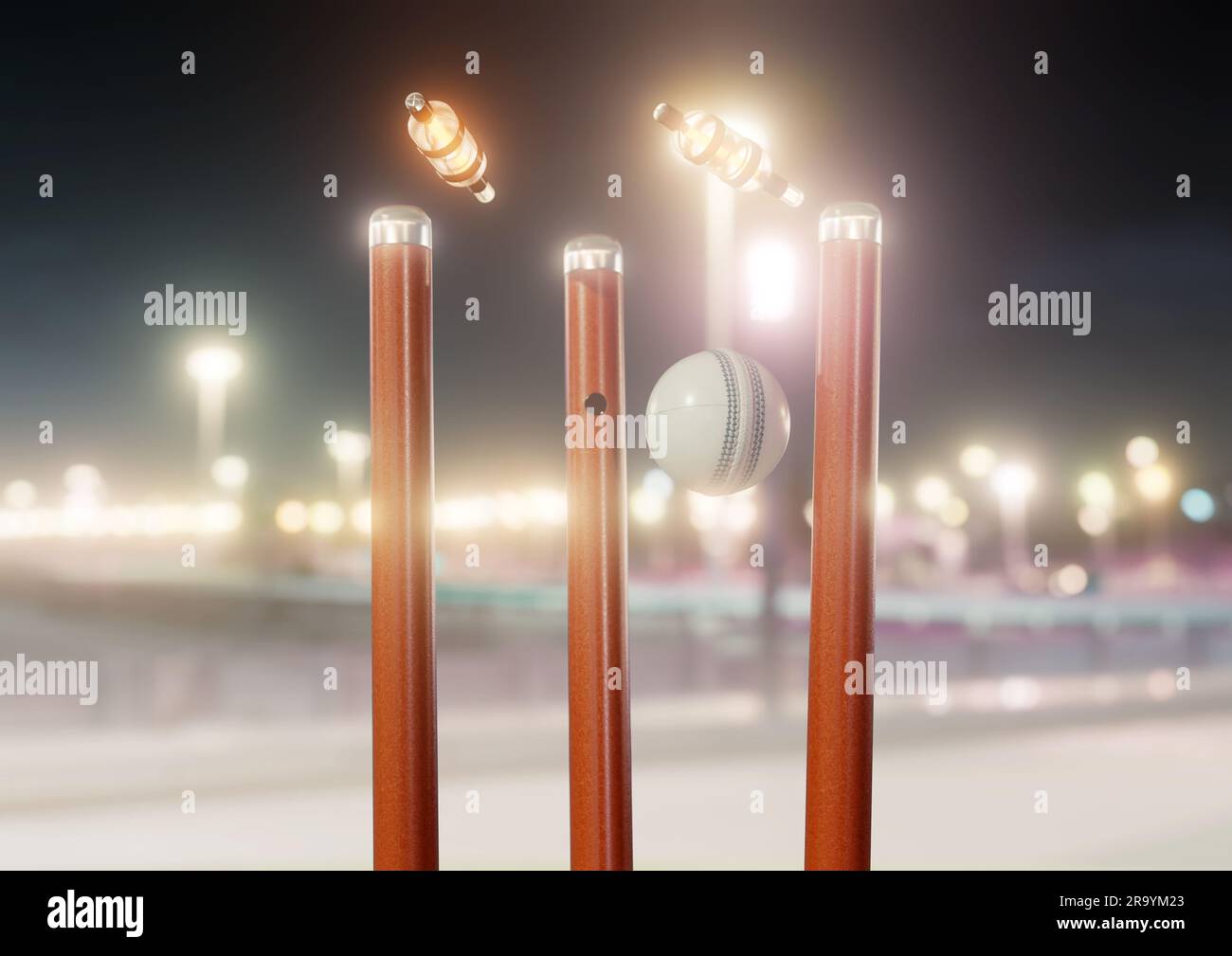 A white cricket ball striking orange electronic cricket wickets with ...