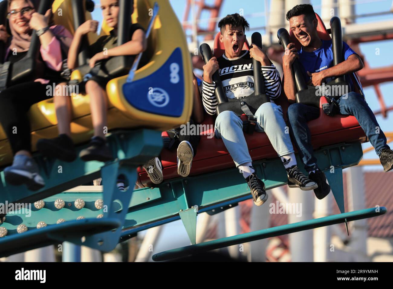 Baghdad, Iraq. 29th June, 2023. People on a ride at Al-Zawraa amusement ...
