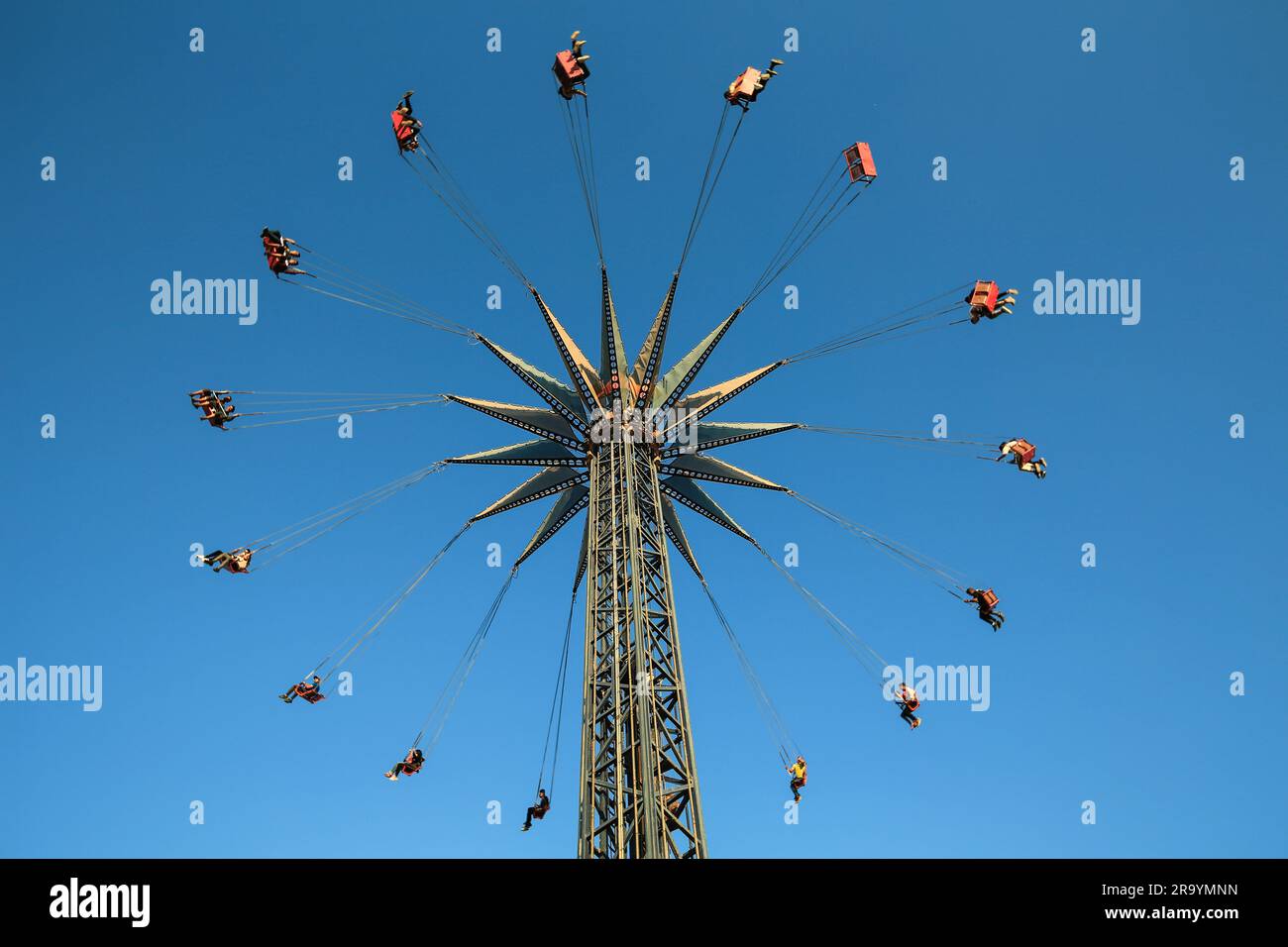 Baghdad, Iraq. 29th June, 2023. People ride on a swing carousel at Al ...