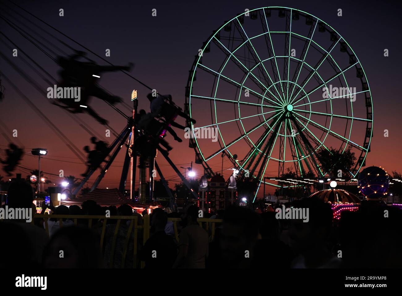 Baghdad, Iraq. 29th June, 2023. The Ferris Wheel spins at Al-Zawraa ...