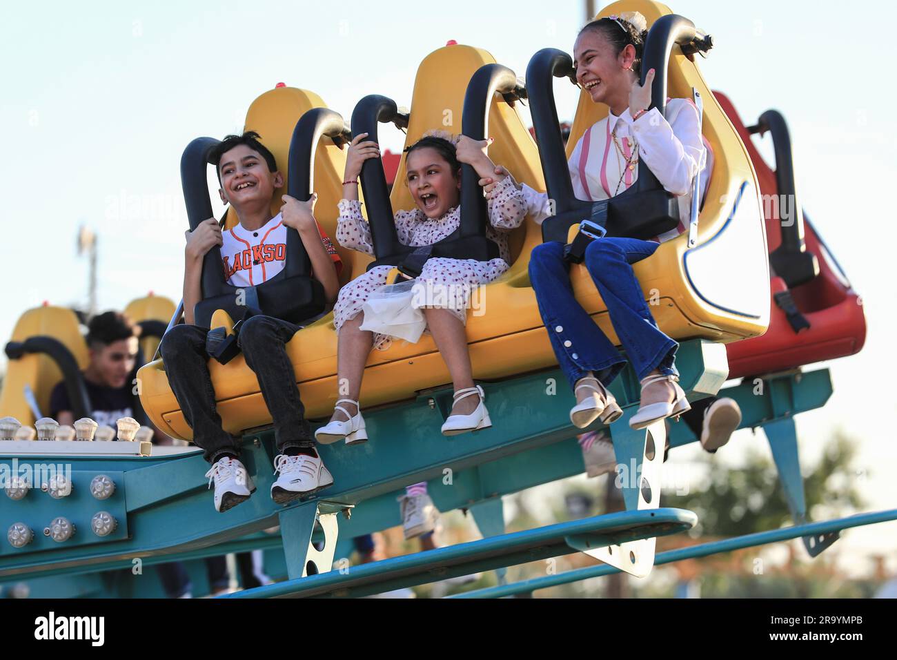 Baghdad, Iraq. 29th June, 2023. People on a ride at Al-Zawraa amusement ...