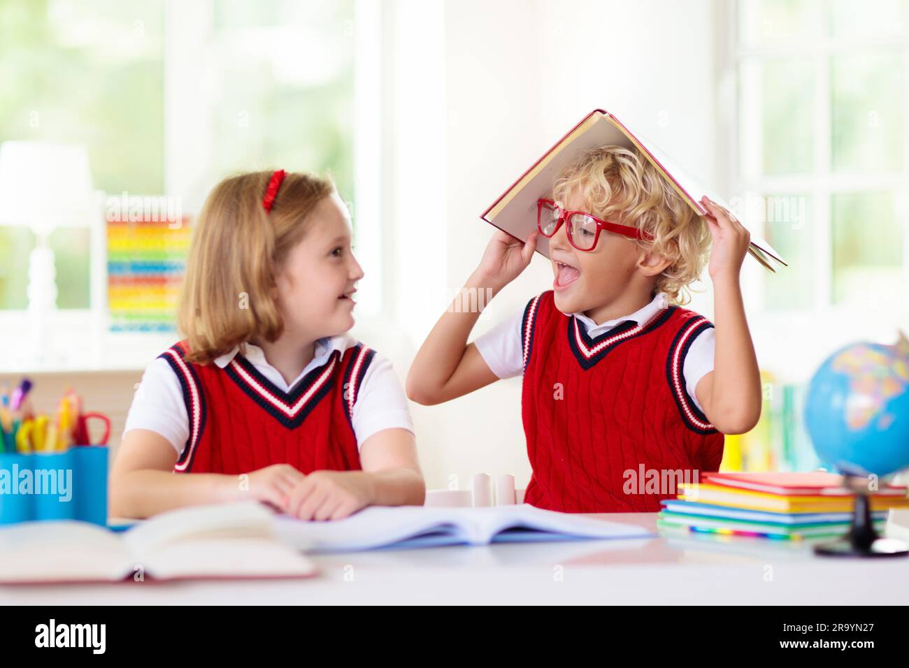 Kids go back to school. Children study and learn for preschool. Boy and ...