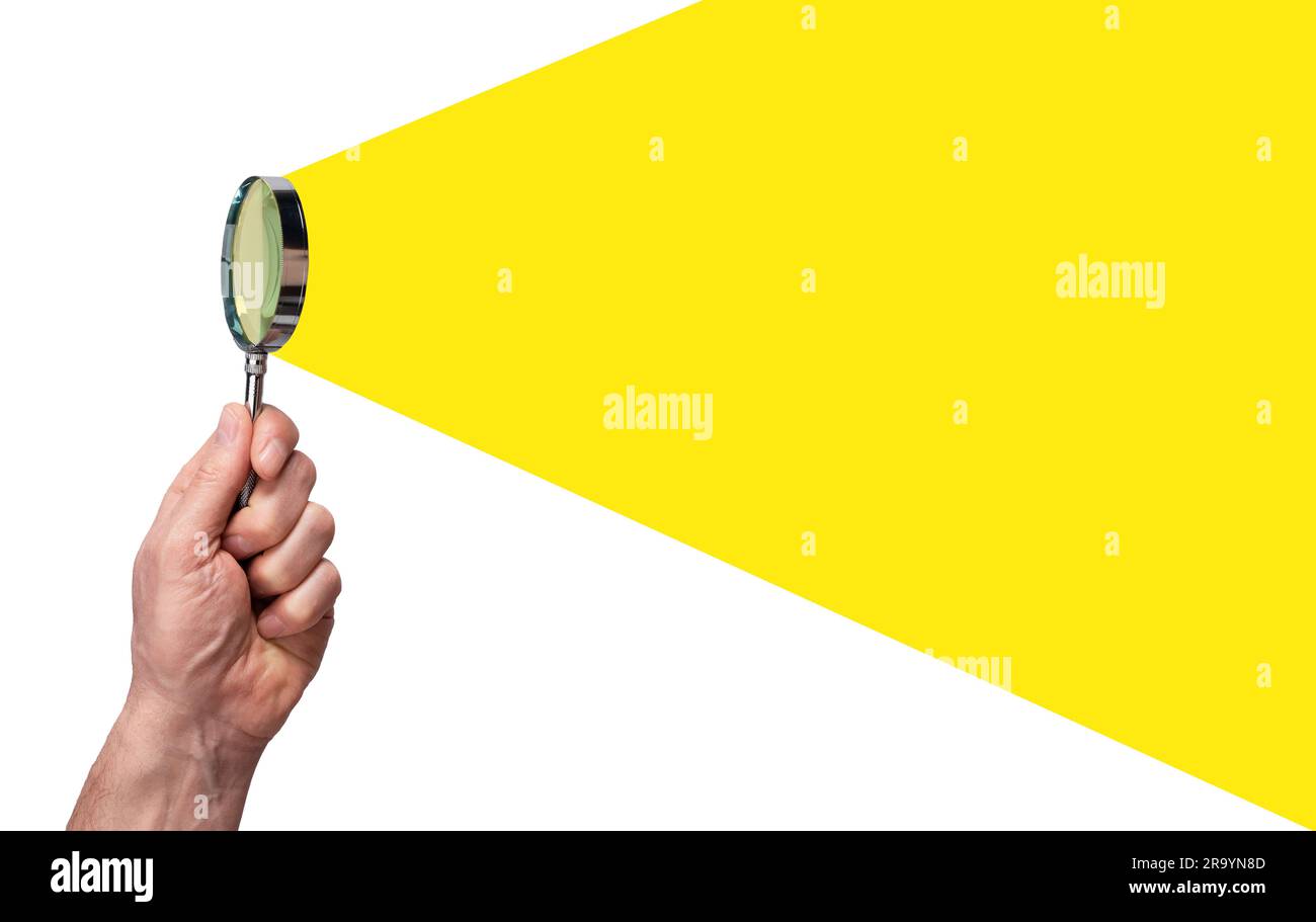Hand holding magnifying glass, searching, researching, looking for ...