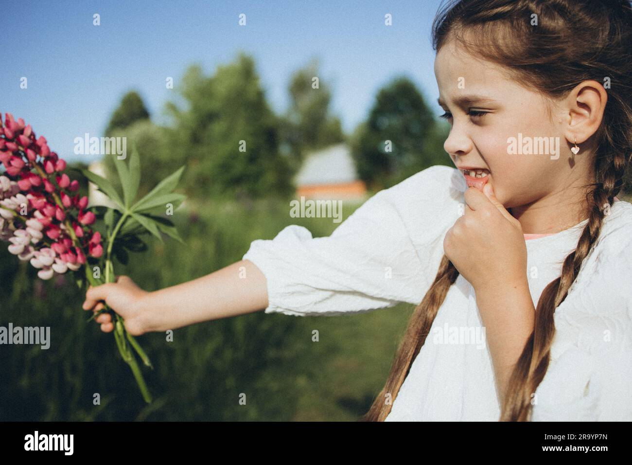 Young girl scared by an insect in nature Stock Photo - Alamy